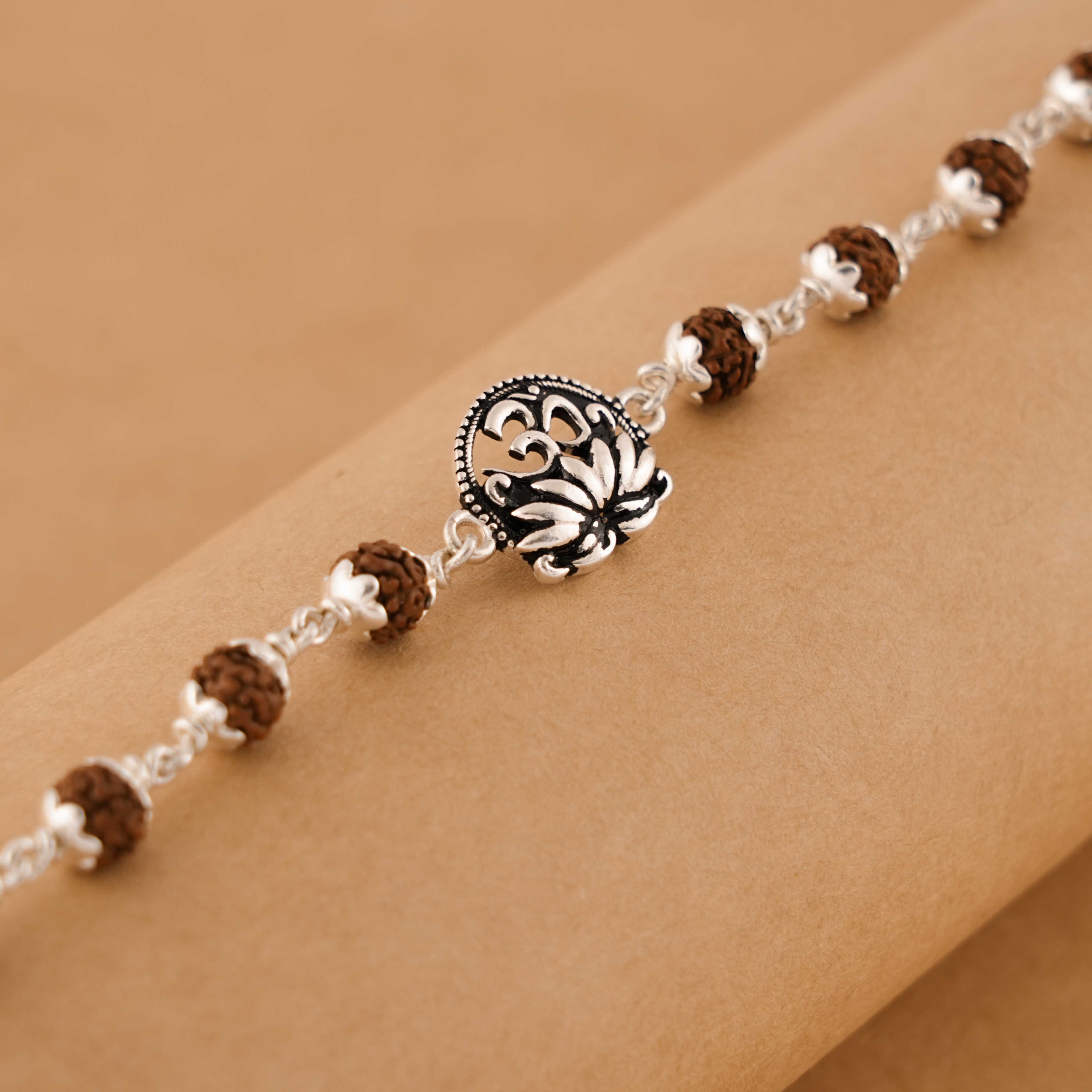 Rudraksha silver bracelet with Om and lotus flower single line for Men Prinjal Jewels